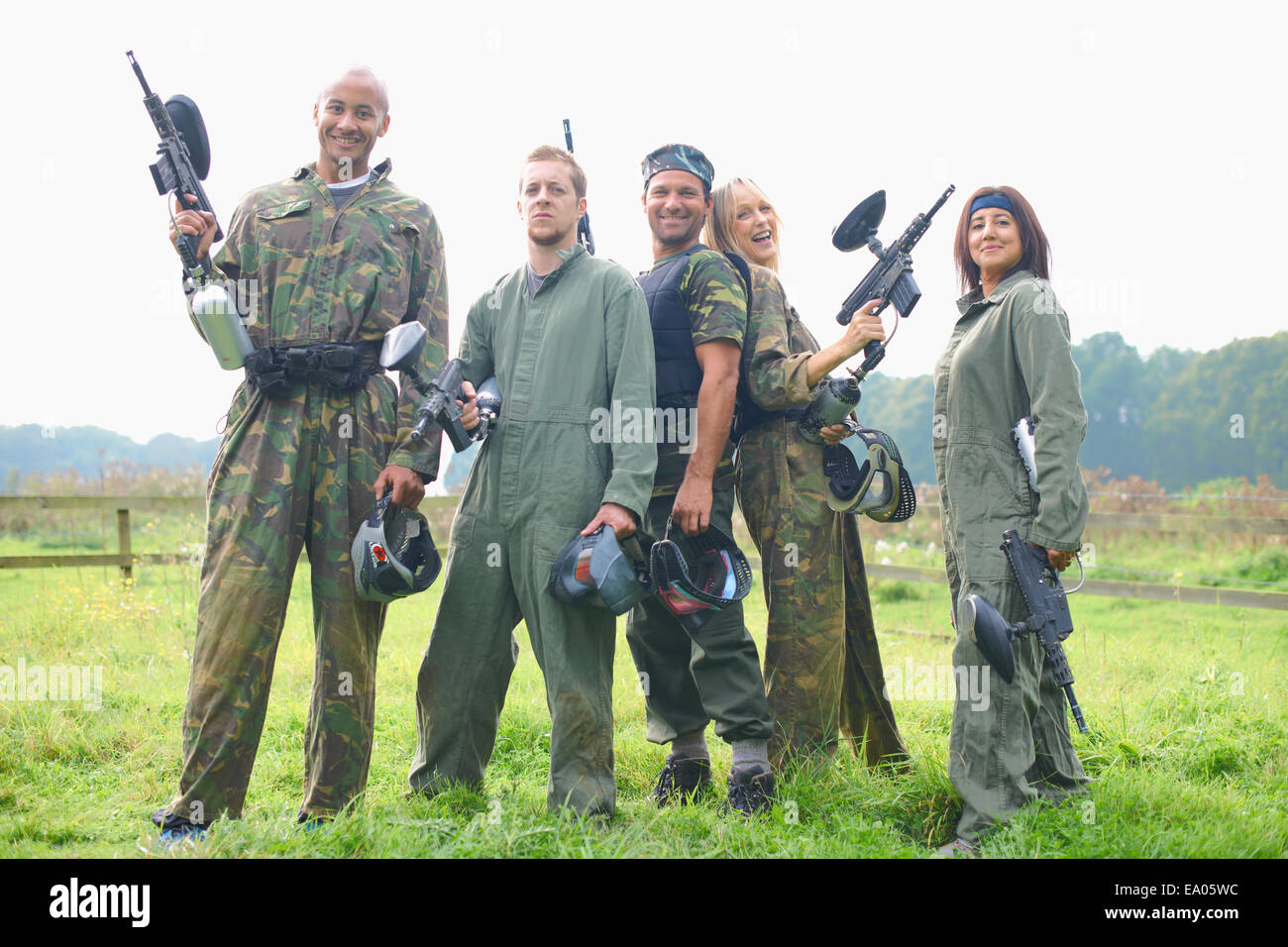 Paintball team in a field Stock Photo - Alamy