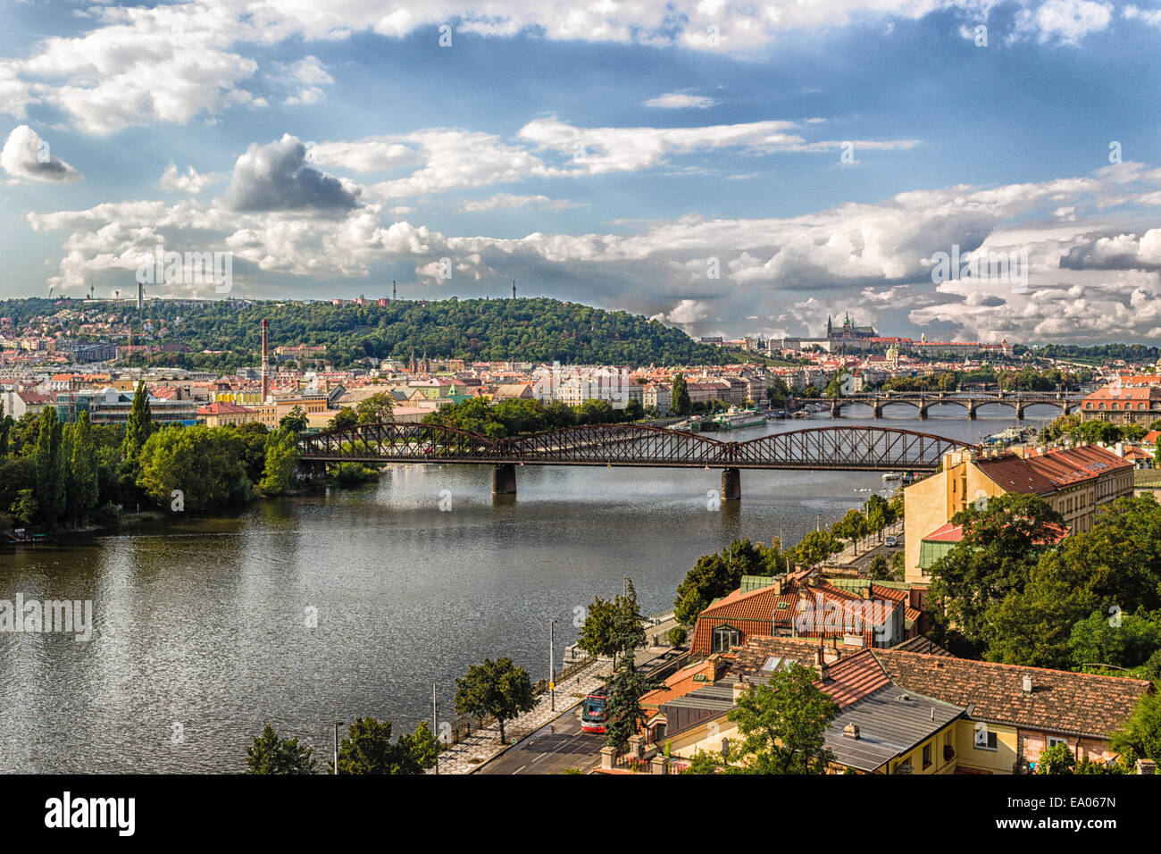 View of Prague from the Vltava river: house, trees, buildings and ...