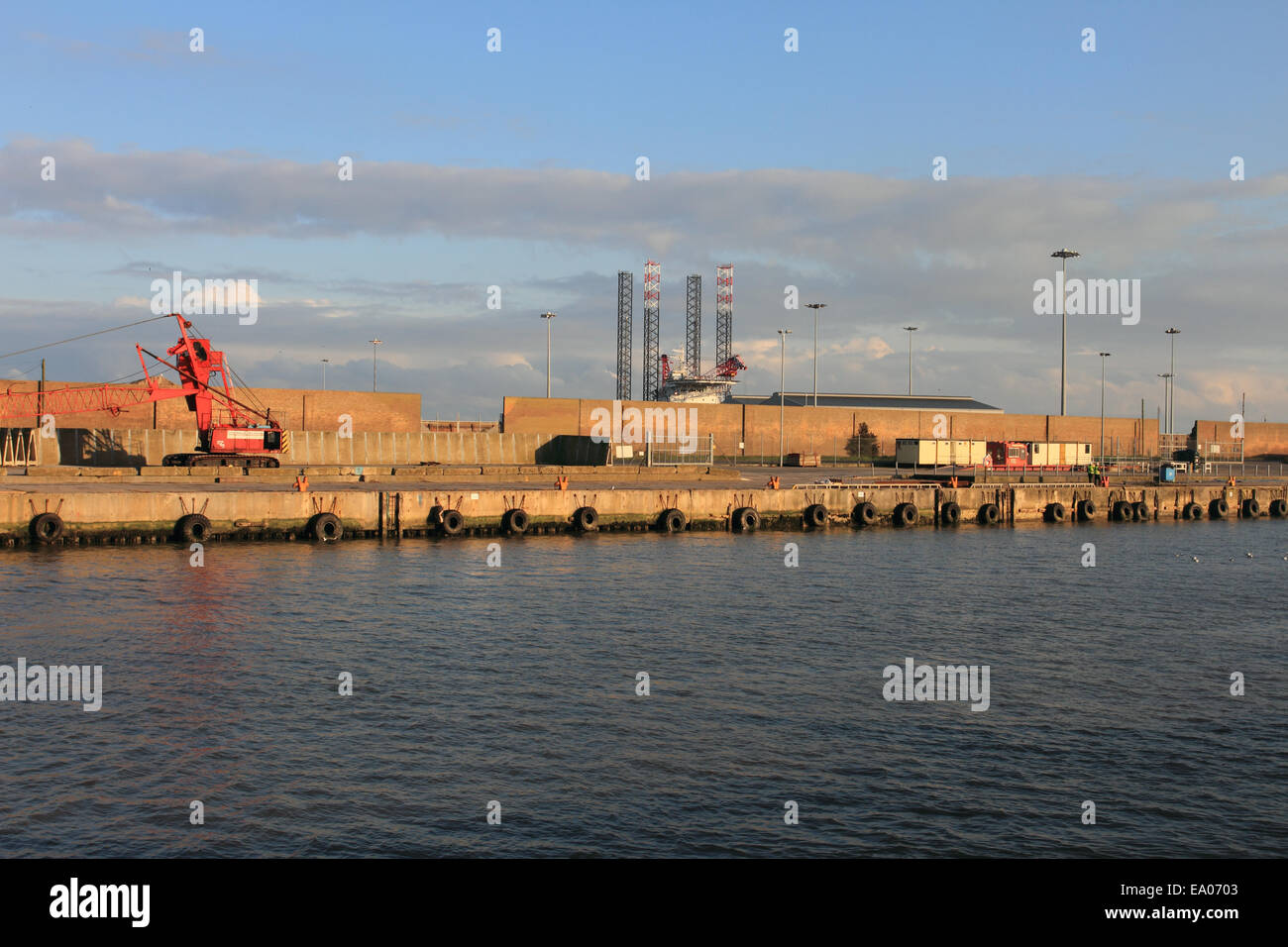 Great Yarmouth harbour, loading goods, crain lefting, power station at ...