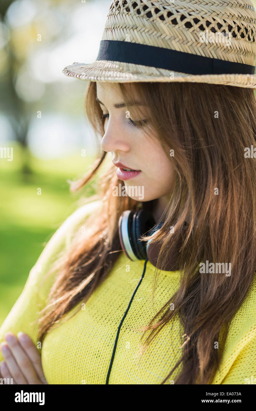 Young woman wearing straw hat, portrait Stock Photo - Alamy