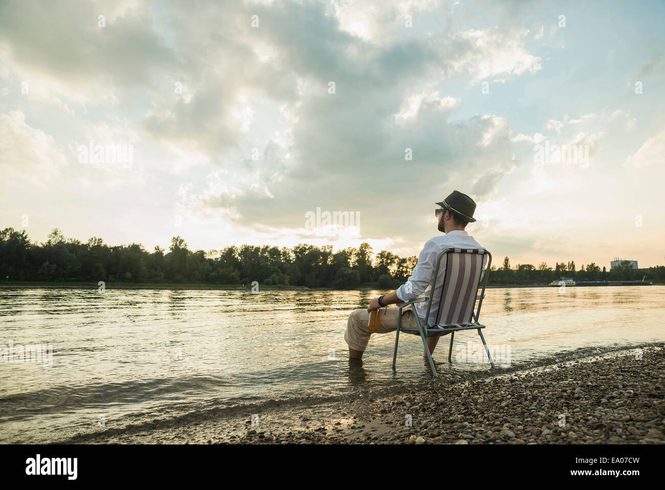 Man sitting chair lake hi-res stock photography and images - Alamy