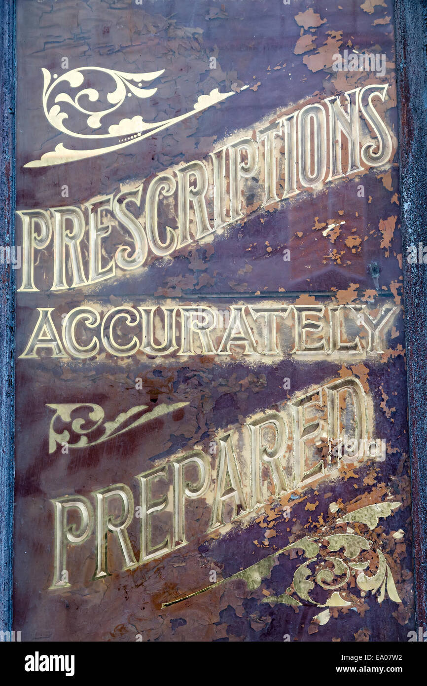 Faded sign on pharmacist's shop Prescriptions accurately prepared ...