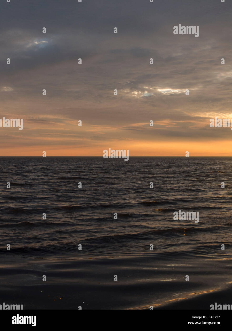 Seascape with sunrise over horizon Stock Photo - Alamy