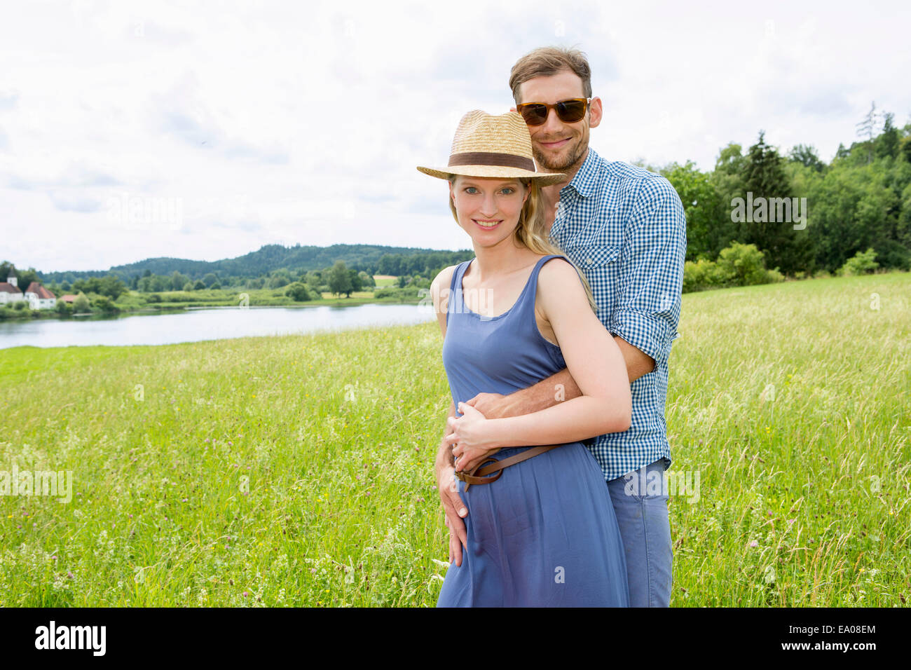 Mid adult couple in field, portrait Stock Photo - Alamy