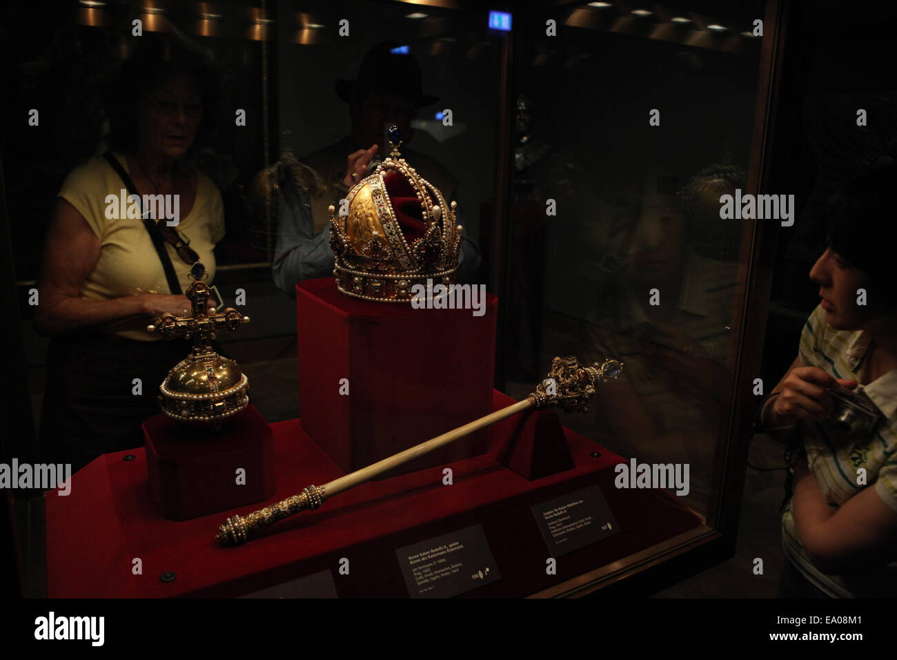 Visitors examine the Imperial Crown of Austria displayed in the ...