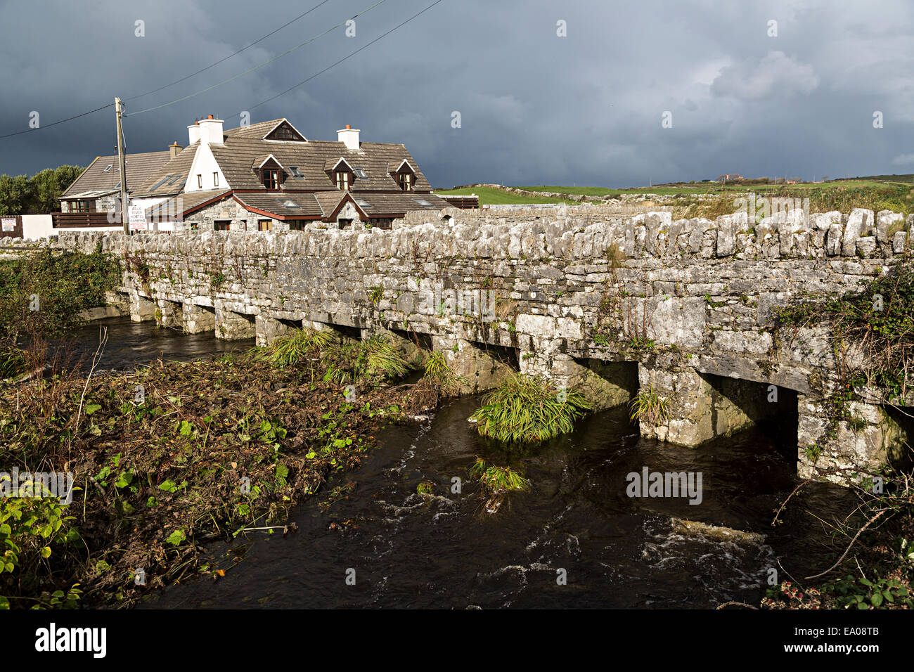 Bridge over the river at Doolin with the hostel behind, Co. Clare ...