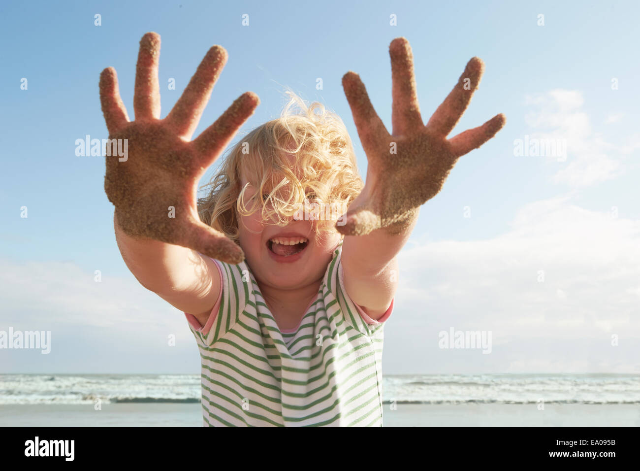 Girl with sandy hands hi-res stock photography and images - Alamy
