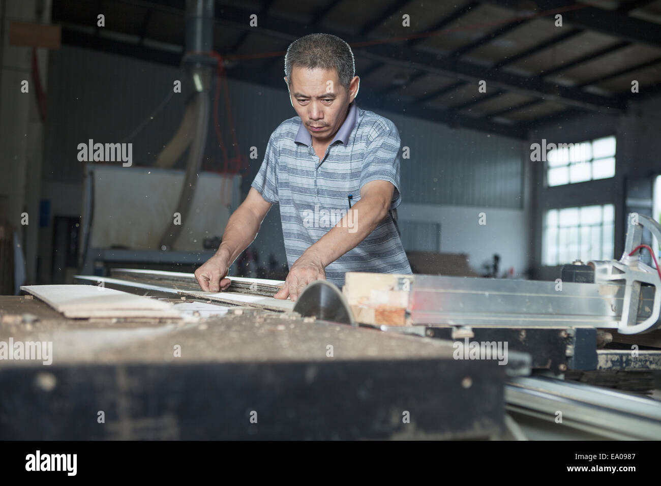 Male Cutting Wood High Resolution Stock Photography and Images - Alamy