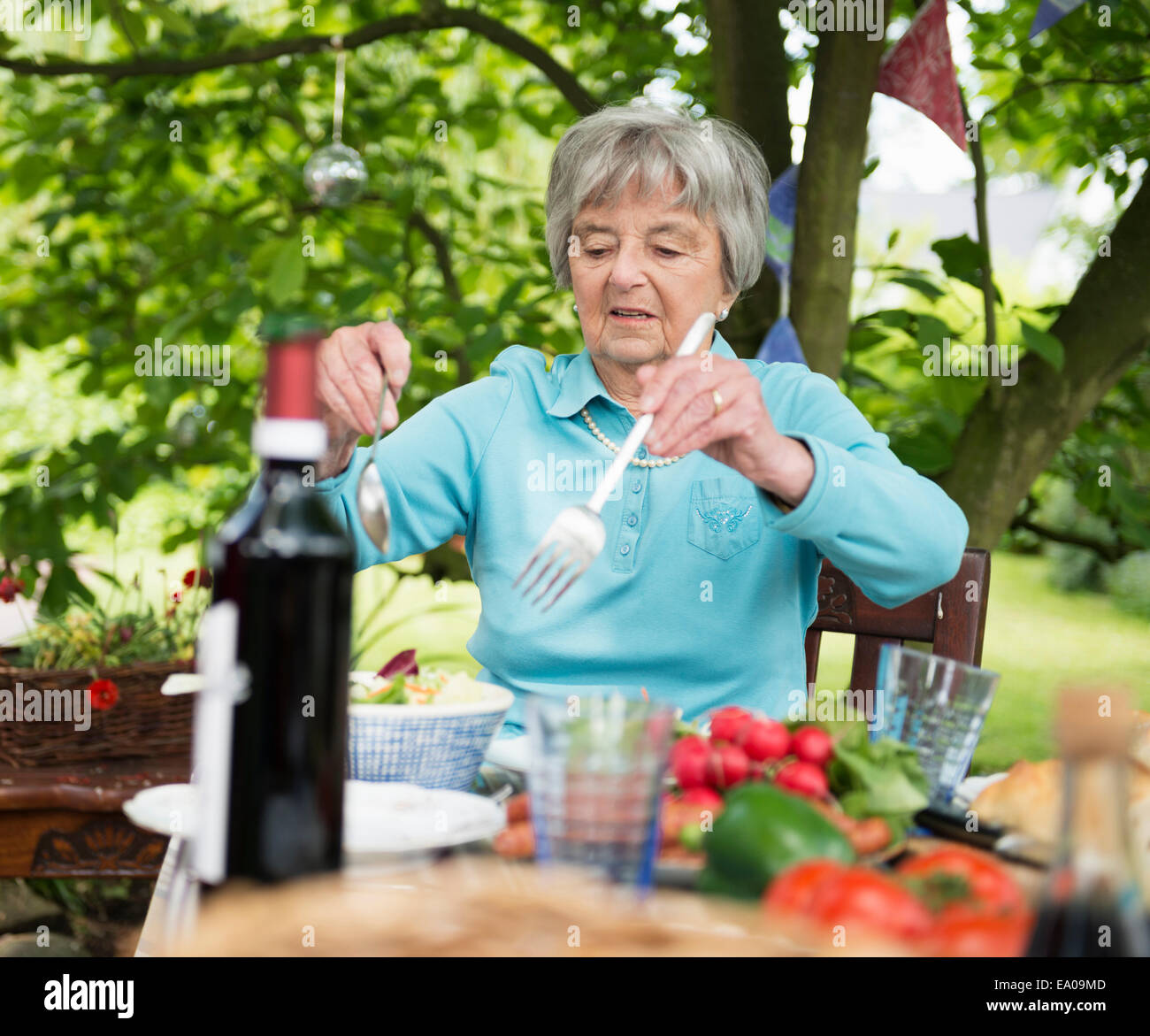 Woman serve salad hi-res stock photography and images - Alamy
