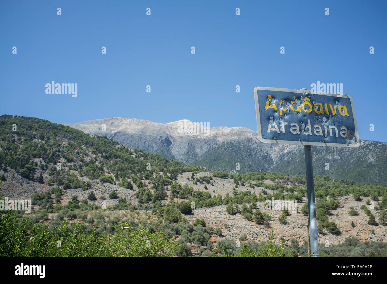 Bullet ridden sign, Aradaina, Crete Stock Photo - Alamy