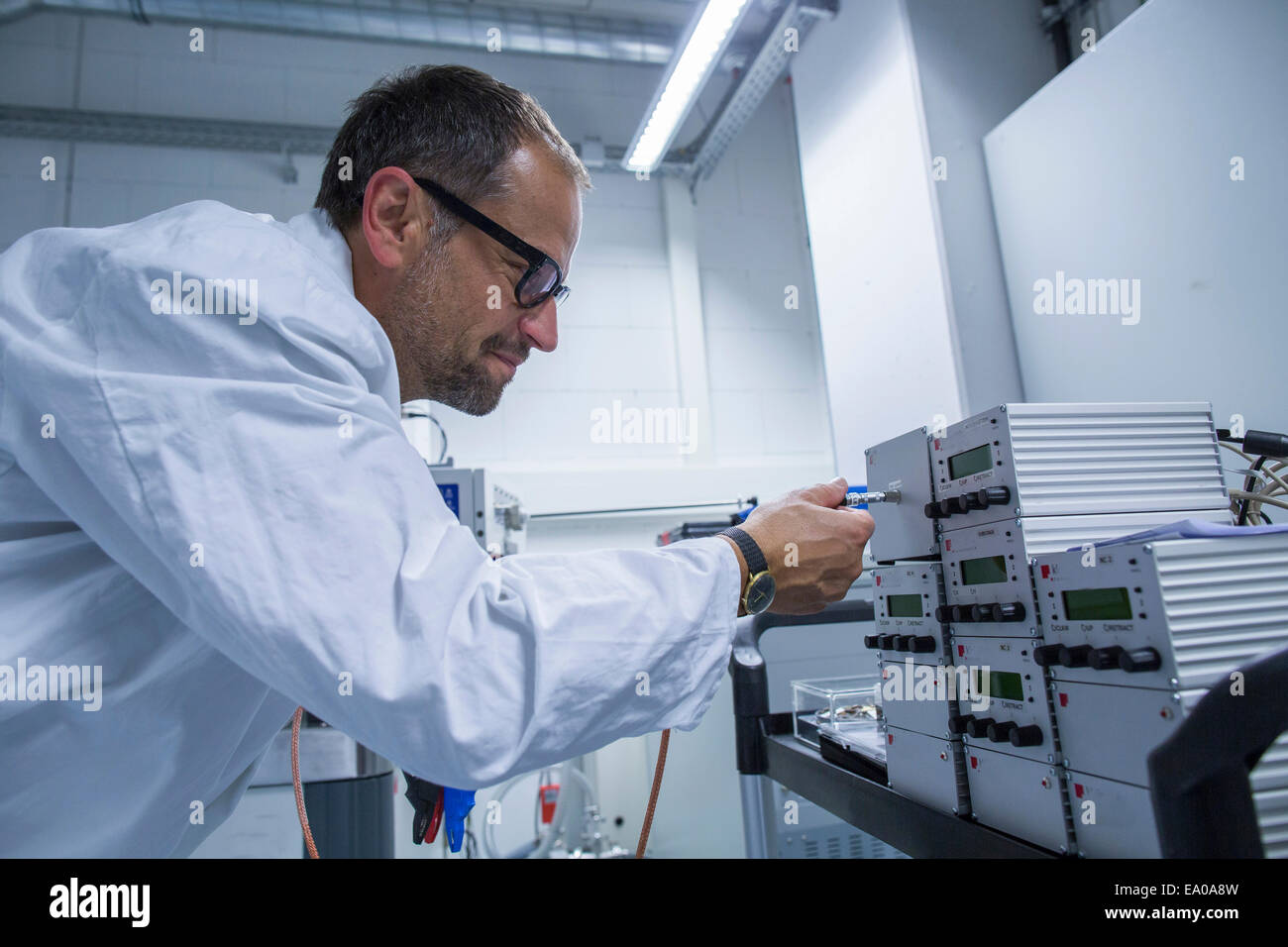 Working on equipment hi-res stock photography and images - Alamy