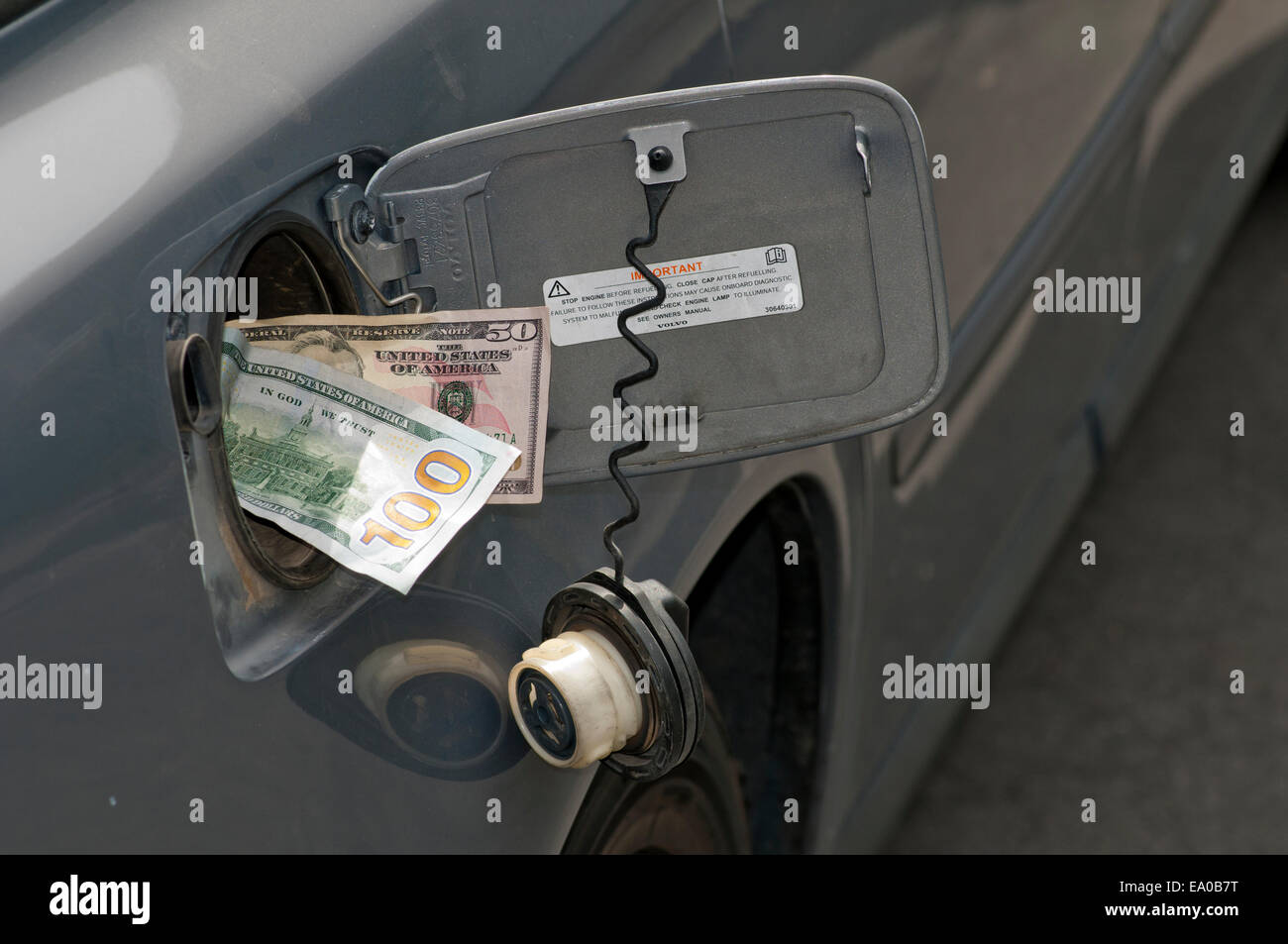 Throwing money down the fuel tank hi-res stock photography and images ...
