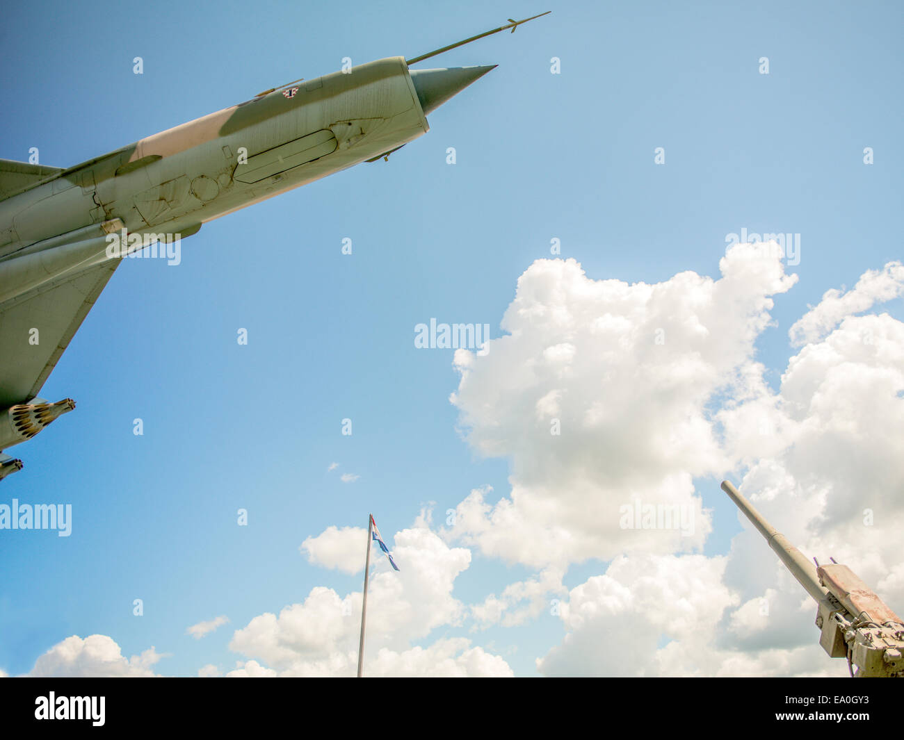 Skyward depiction of a jet fighter, national flag and gun barrel Stock ...