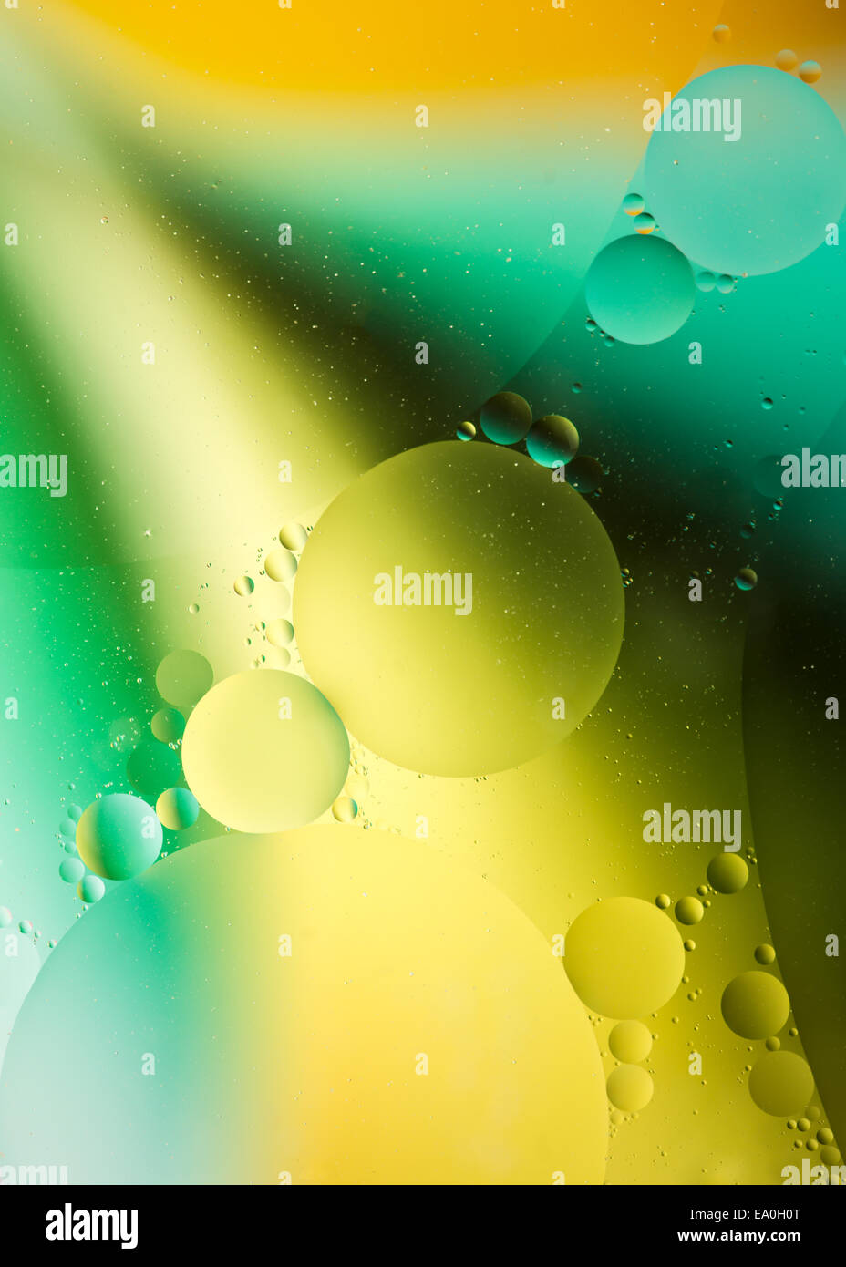 oil drops on water surface, with colorful background Stock Photo - Alamy