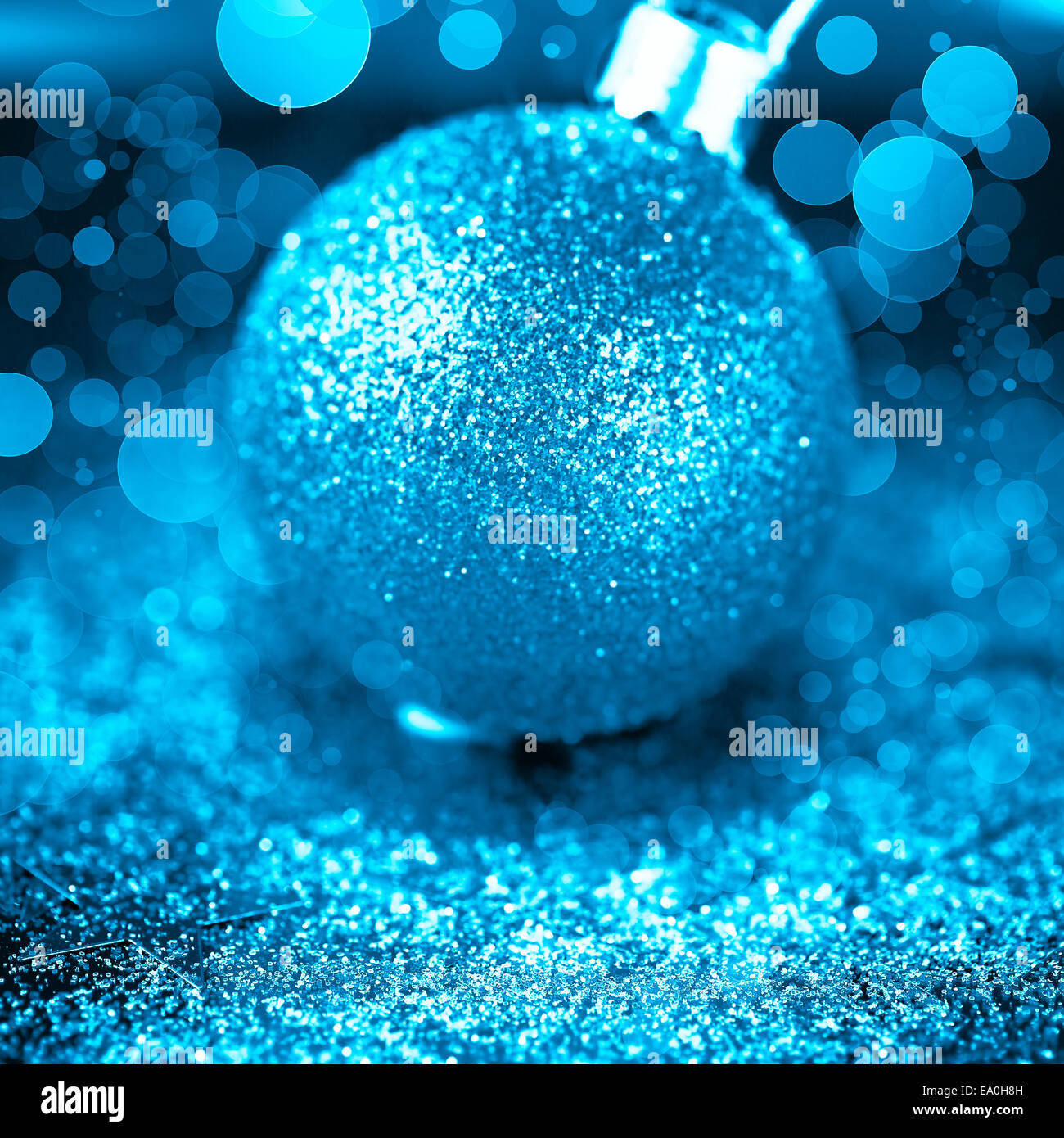 Christmas background with blue bauble on deep blue background with ...