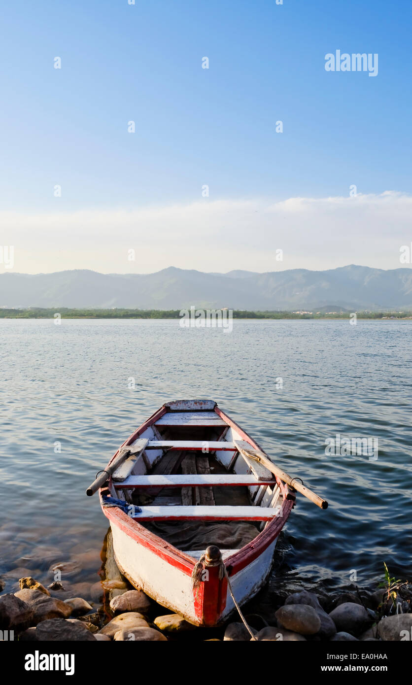 Empty boat on a lake Stock Photo - Alamy