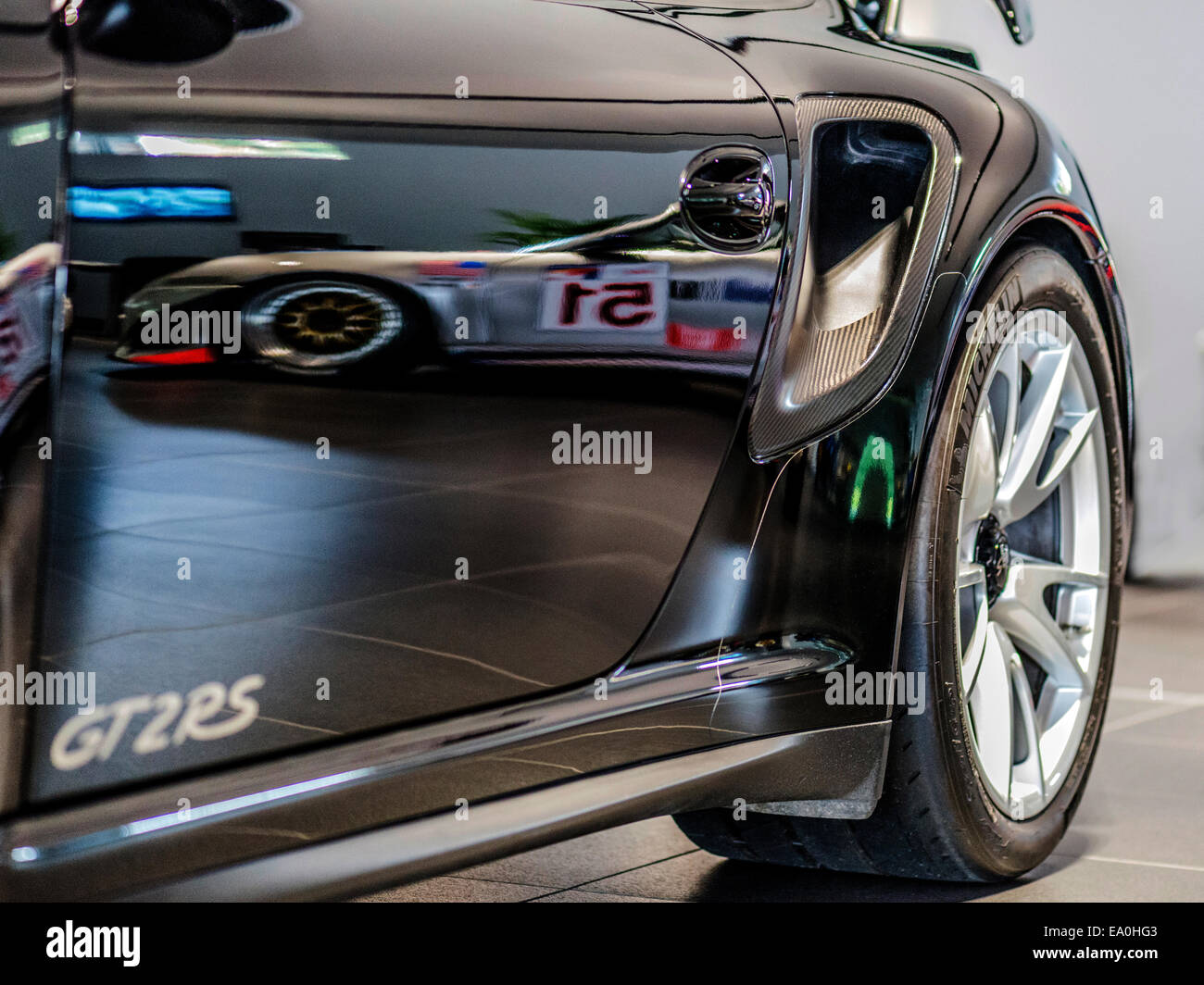 Porsche 911 GT2RS, black, mid to rear macro with race car reflection ...