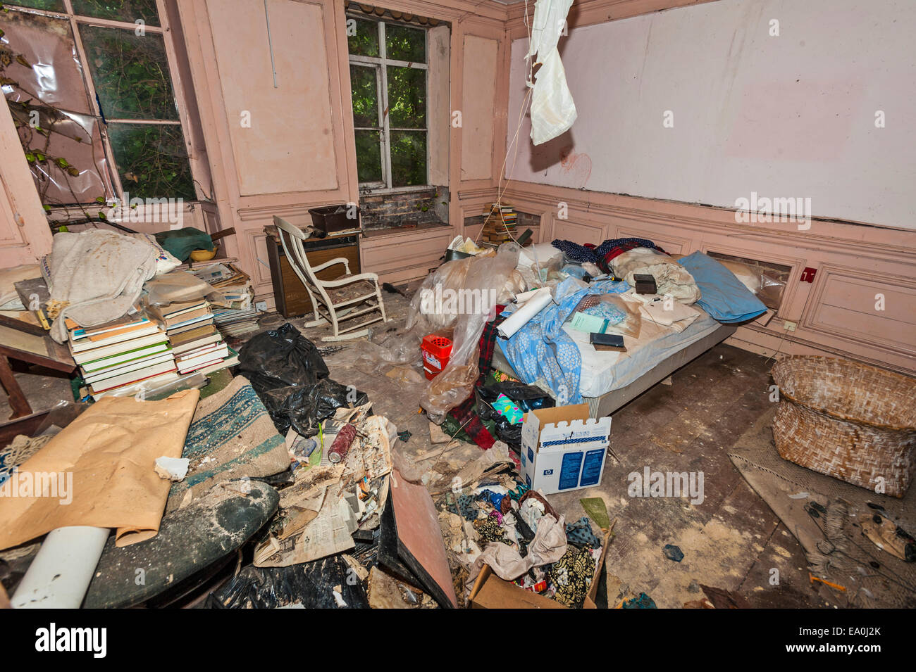 A chaotic bedroom room, filled with junk, in an abandoned house Stock ...