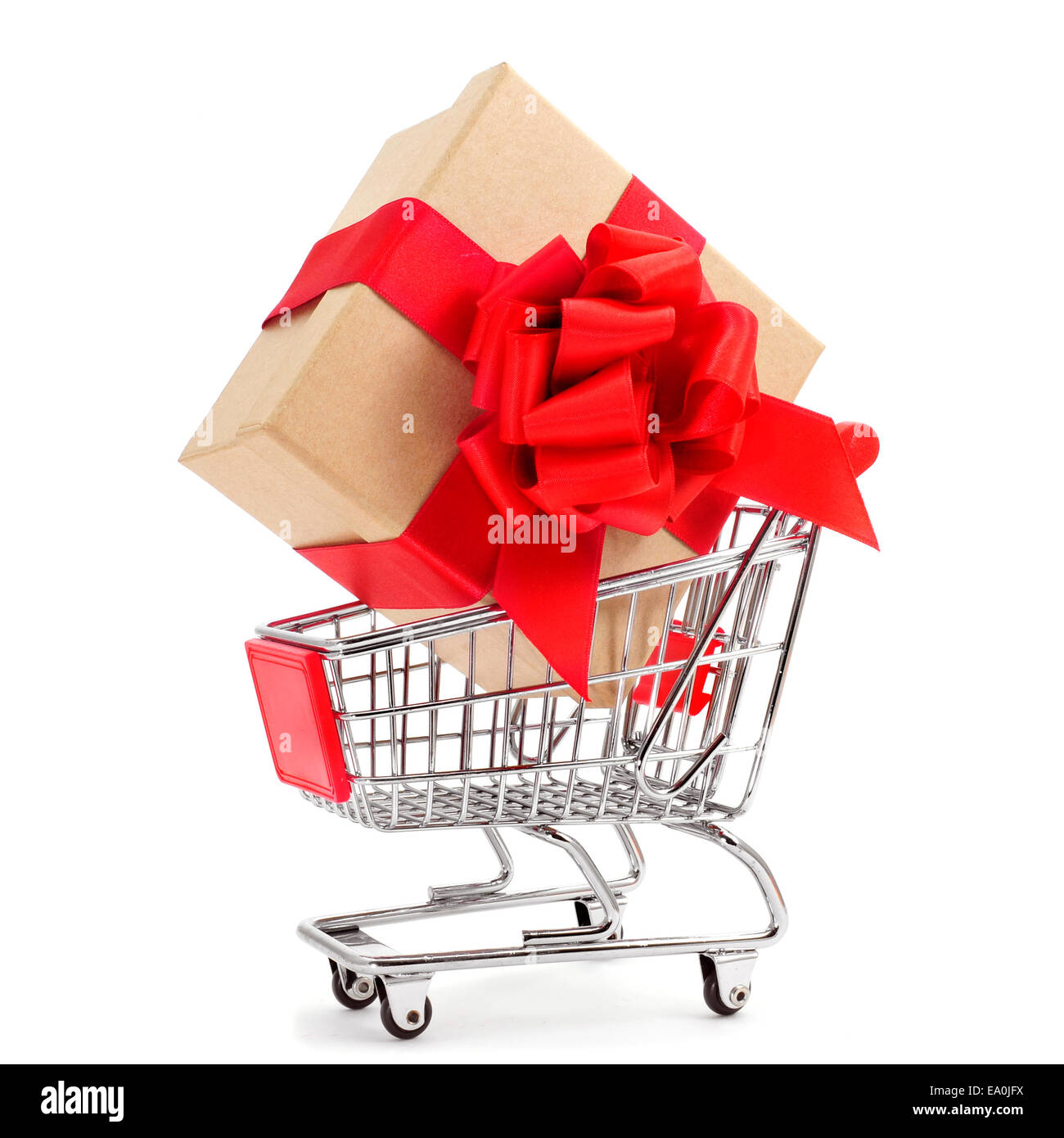 a cardboard gift box with a red ribbon bow in a shopping cart on a ...