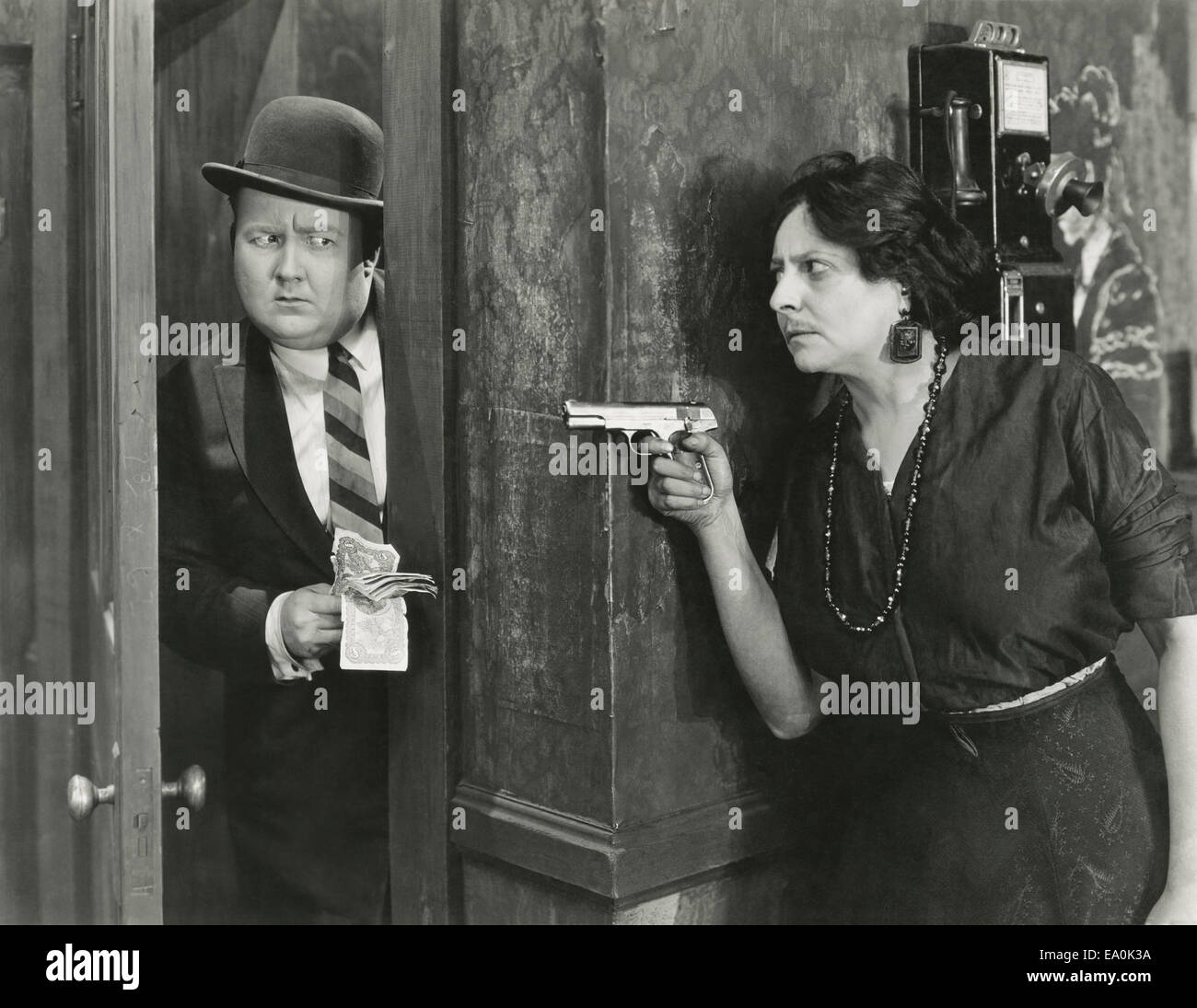 Criminal holding man gunpoint hi-res stock photography and images - Alamy