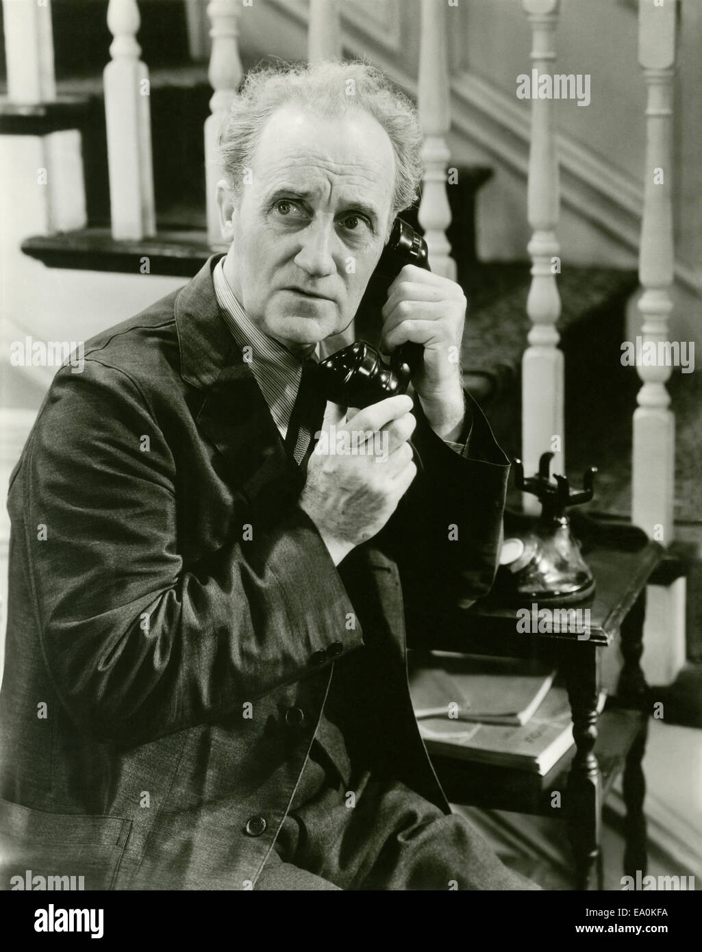 Sneaking in a phone call Stock Photo - Alamy