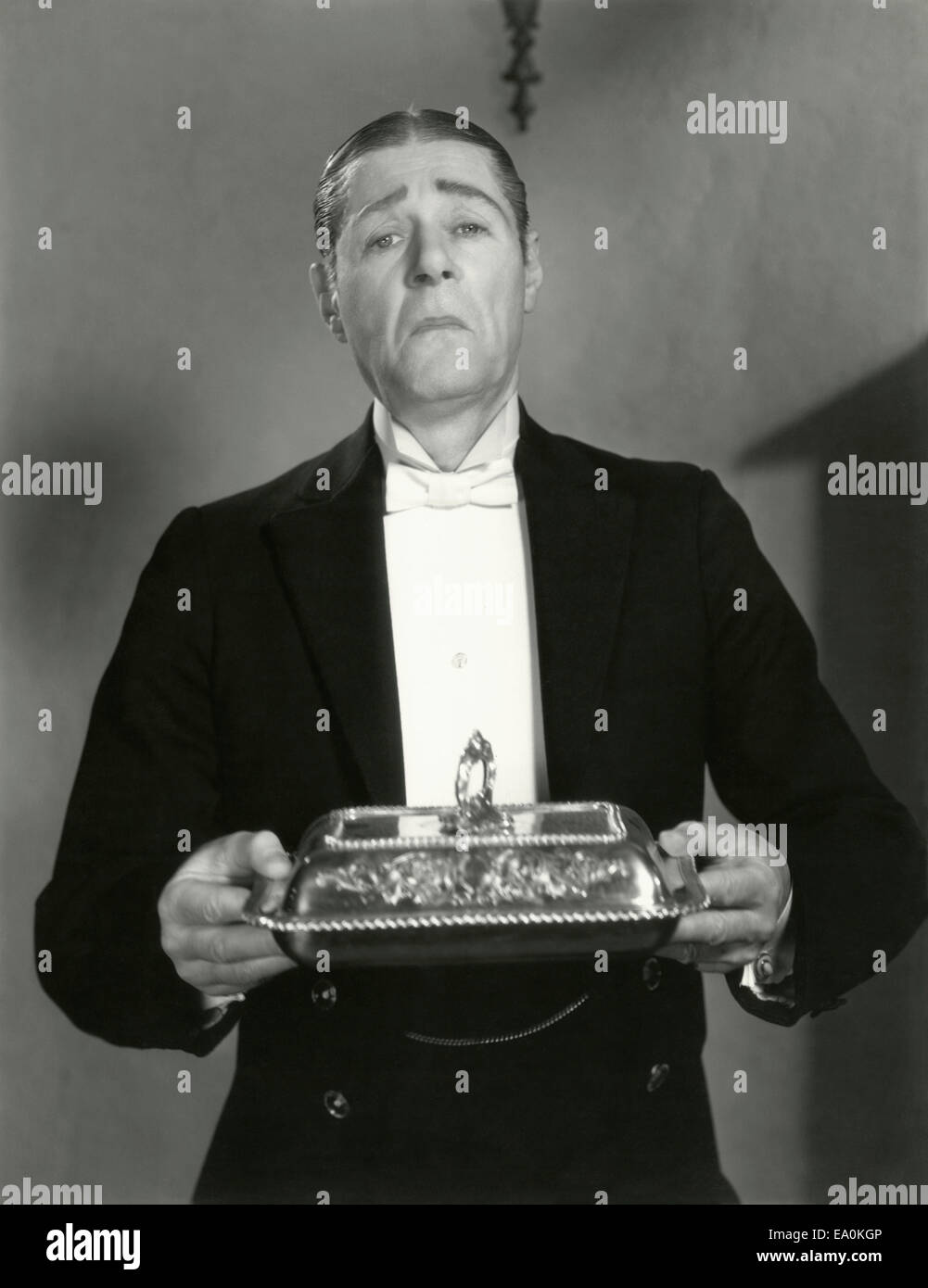 Vintage waiter carrying tray hi-res stock photography and images - Alamy