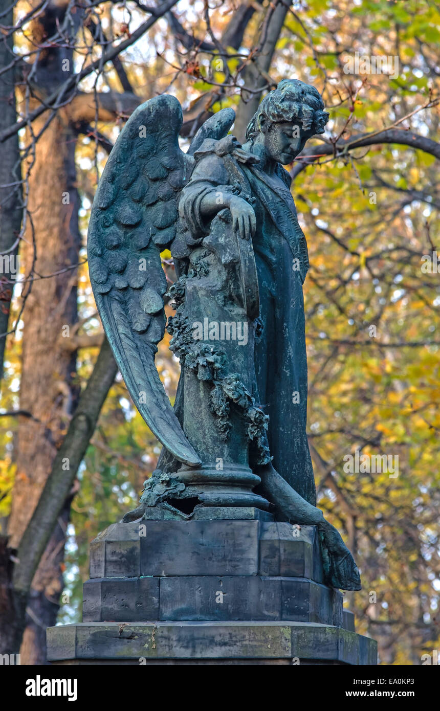 Poland, Warsaw: Statue of an angel at the Powazki Cemetery, the oldest ...