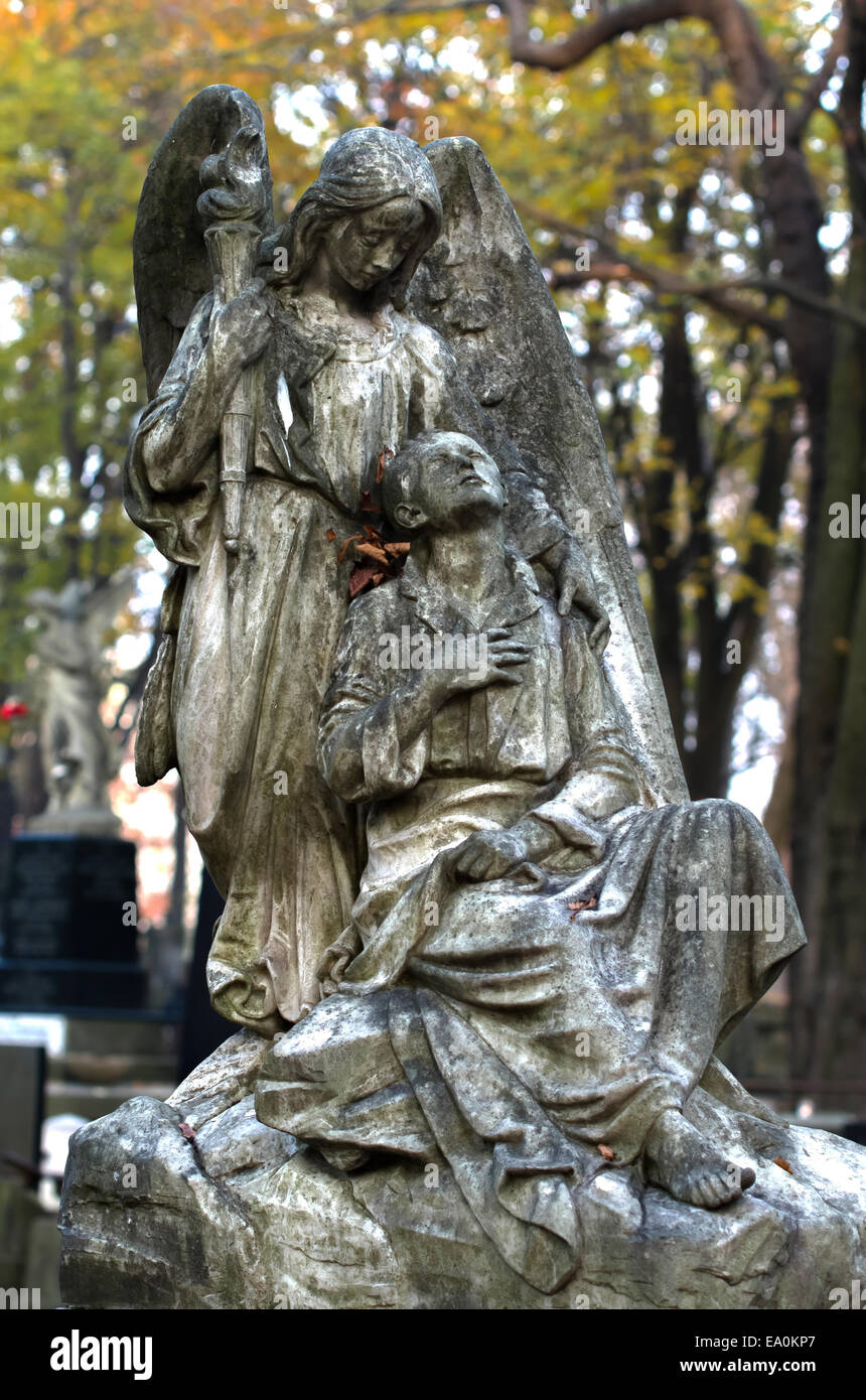 Poland, Warsaw: Statue of an angel at the Powazki Cemetery, the oldest ...