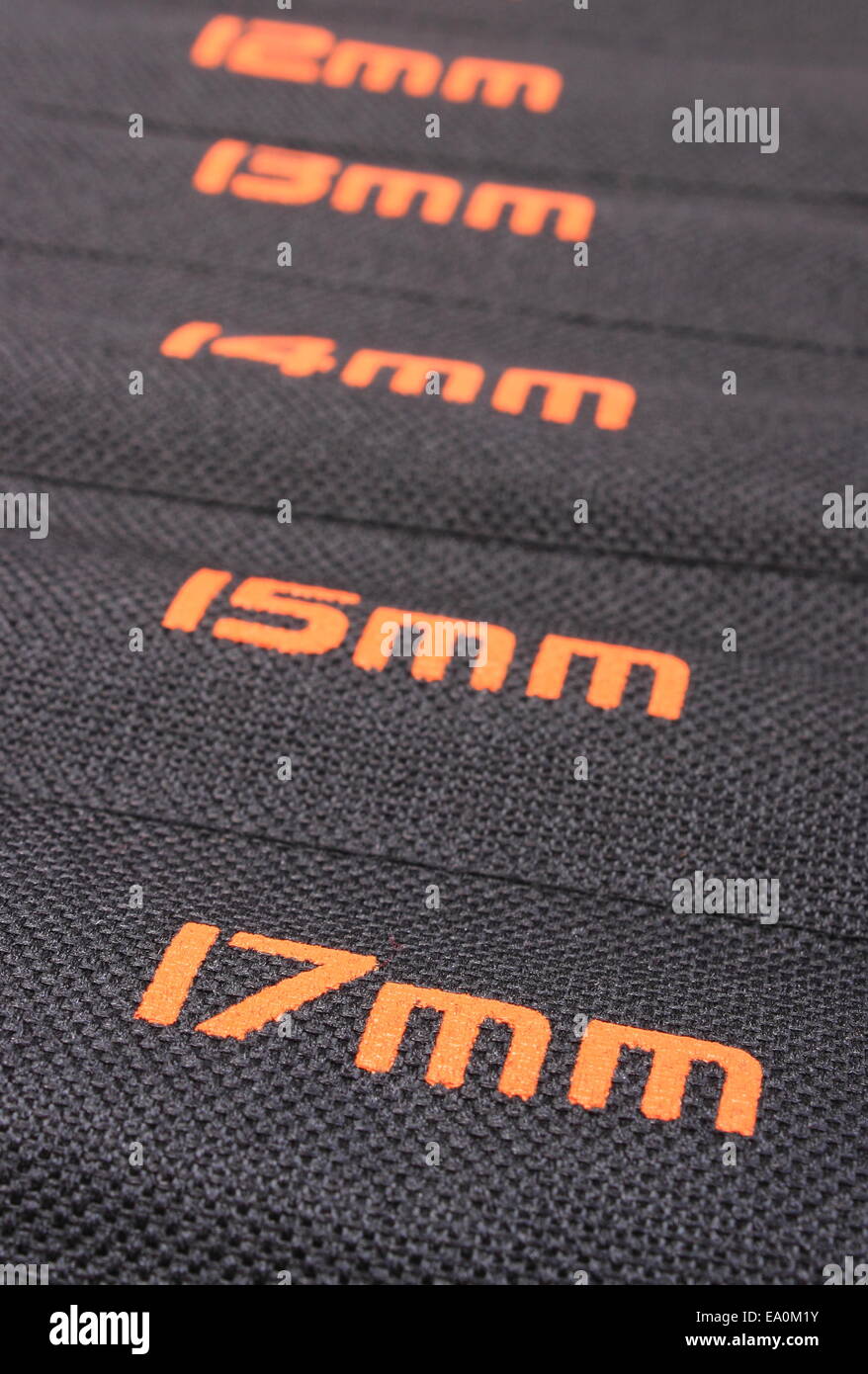 Sizes of wrenches written on black cover Stock Photo - Alamy