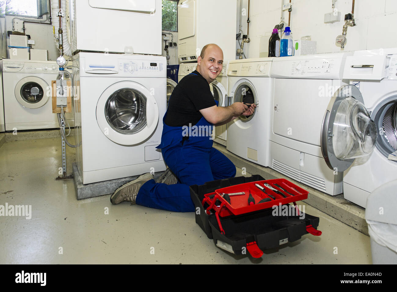 Repairing washing machine hi-res stock photography and images - Alamy