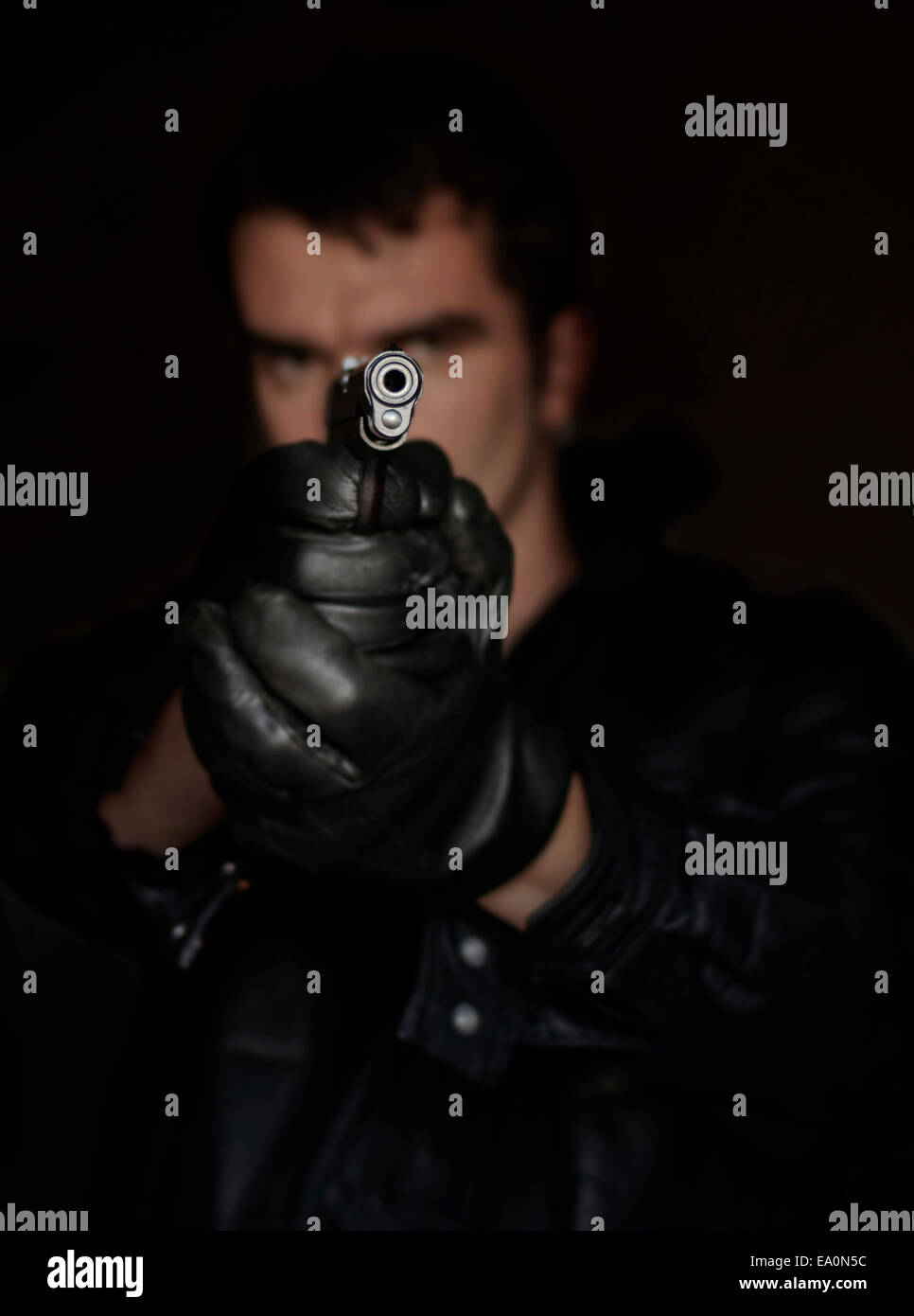 Man with a gun Stock Photo - Alamy