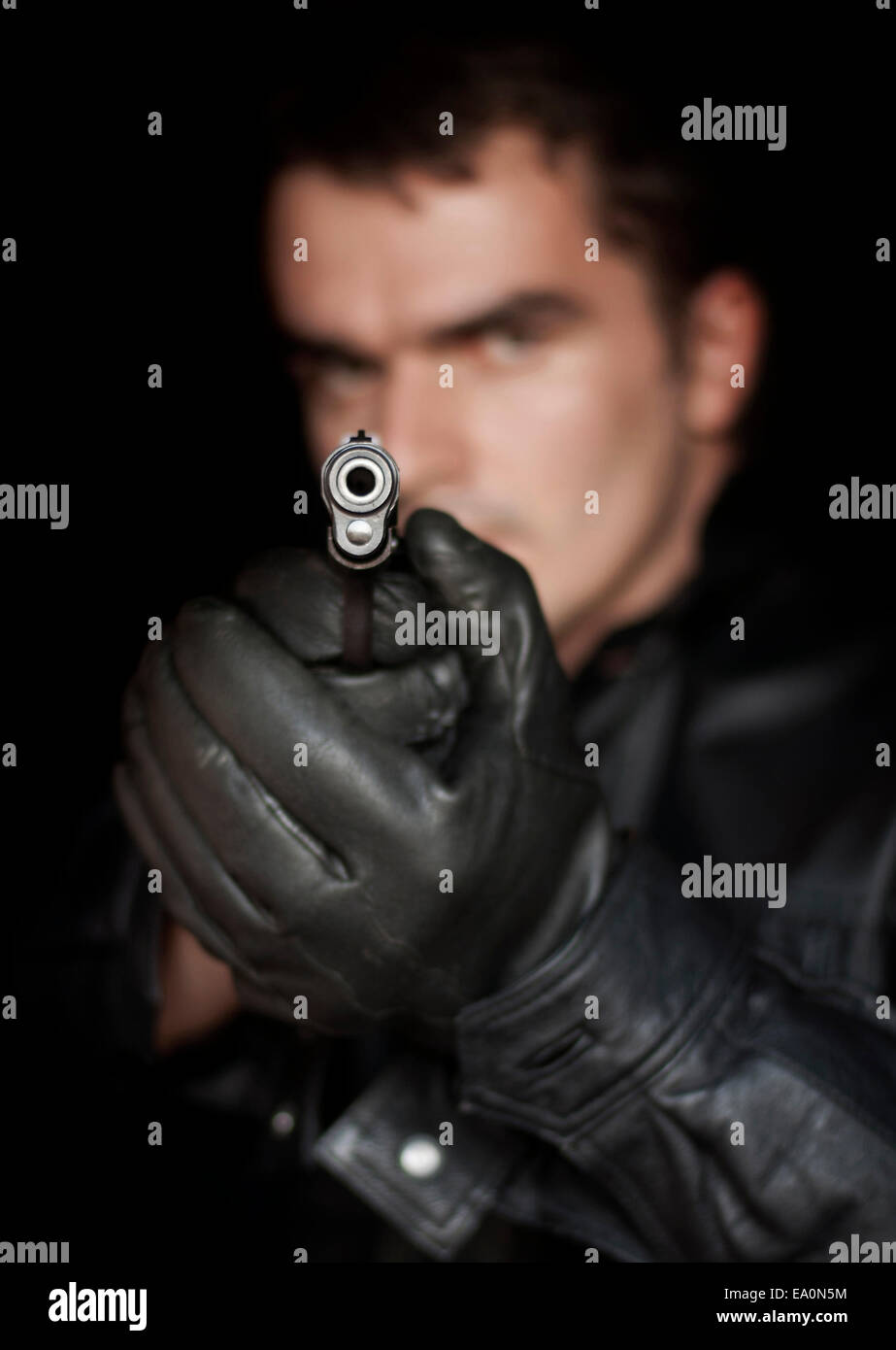 Man with a gun Stock Photo - Alamy