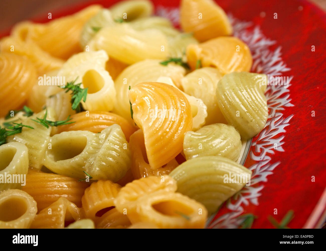 Colorful Italian conchiglie pasta Stock Photo - Alamy