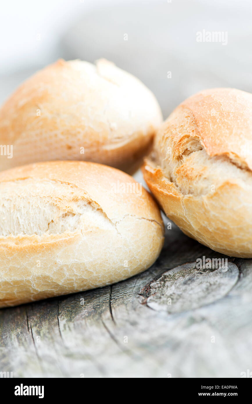 Bread on wooden table shallow DOF Stock Photo - Alamy
