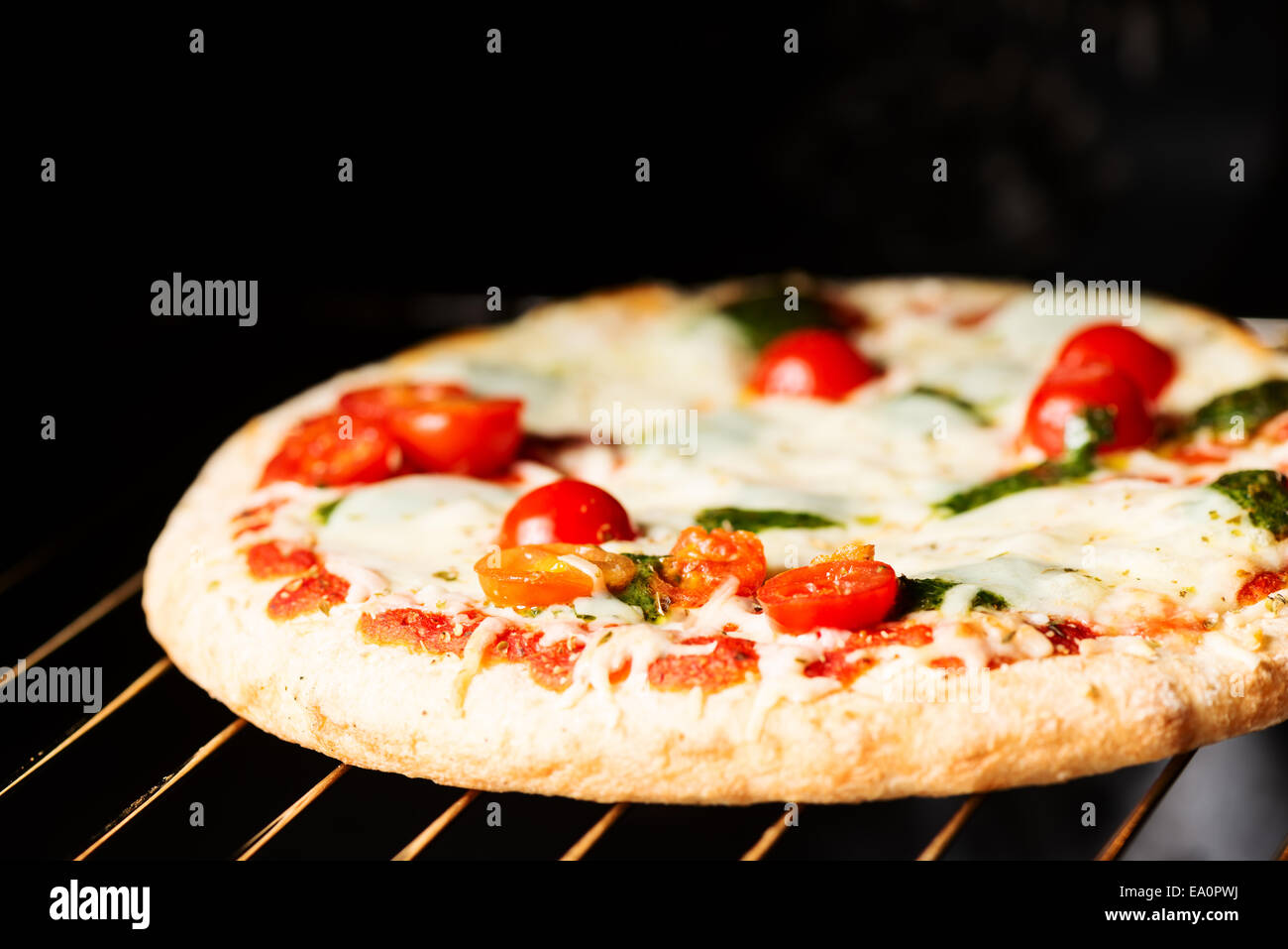Cooking pizza in oven horizontal Stock Photo - Alamy