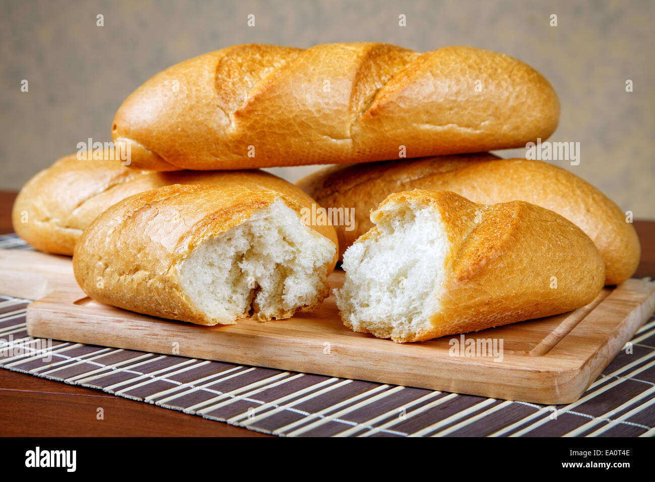 Pile of white rolls on a kitchen table Stock Photo - Alamy