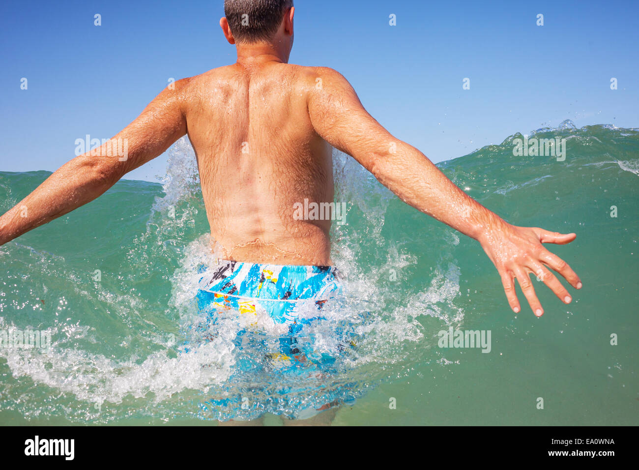 Man in the wave Stock Photo - Alamy