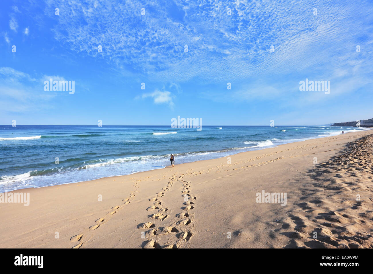 A lone tourist on a beach Stock Photo - Alamy