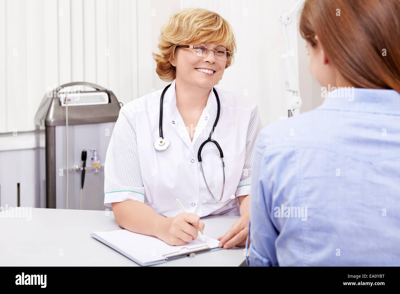 Doctor with patient Stock Photo - Alamy