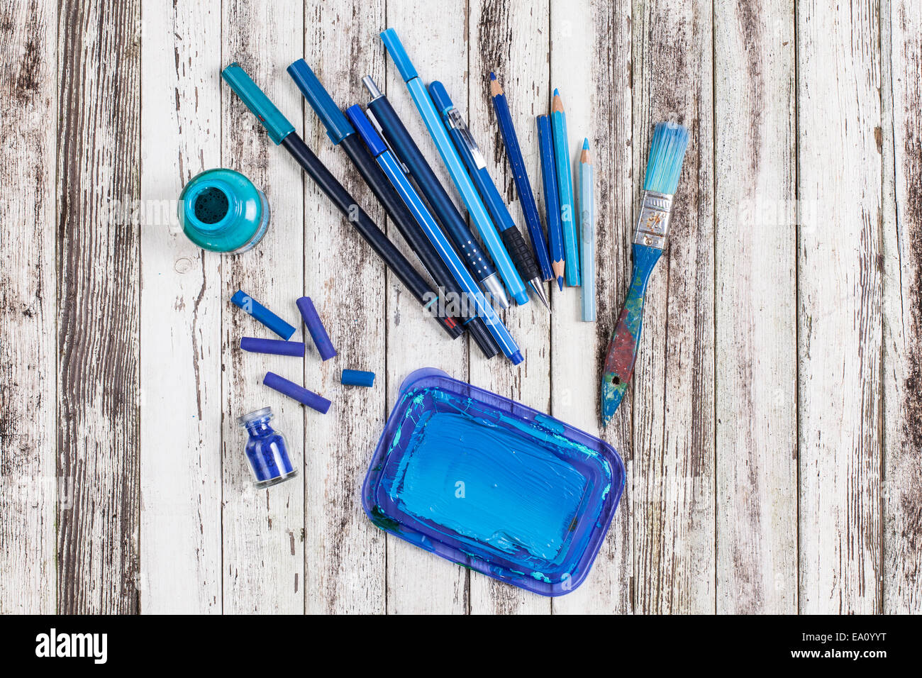 Still life of blue paint brush, crayons and colored pencils Stock Photo ...