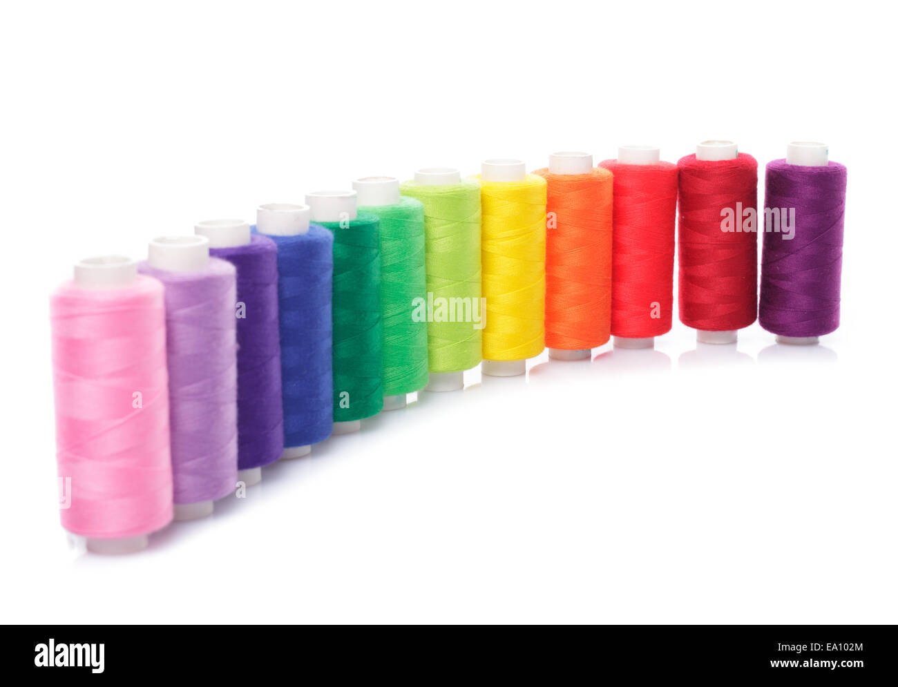 Sewing multicolored threads isolated on a white Stock Photo - Alamy