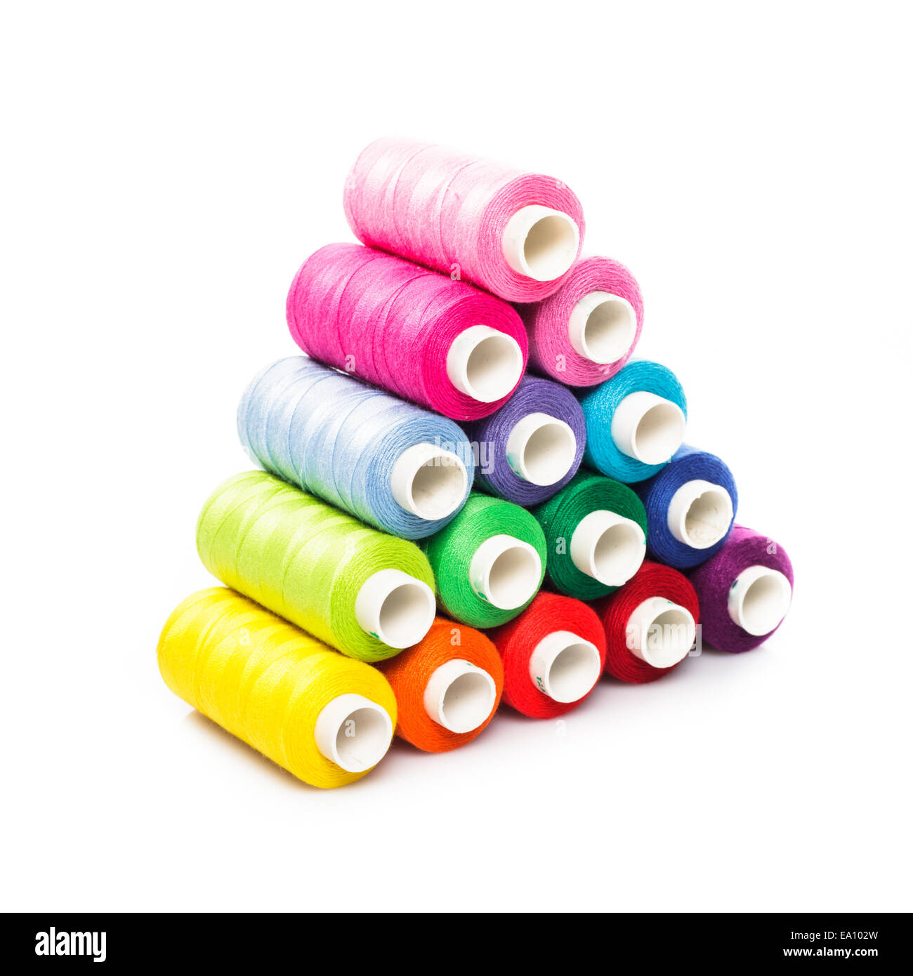 Sewing multicolored threads as a pyramid isolated on white Stock Photo ...