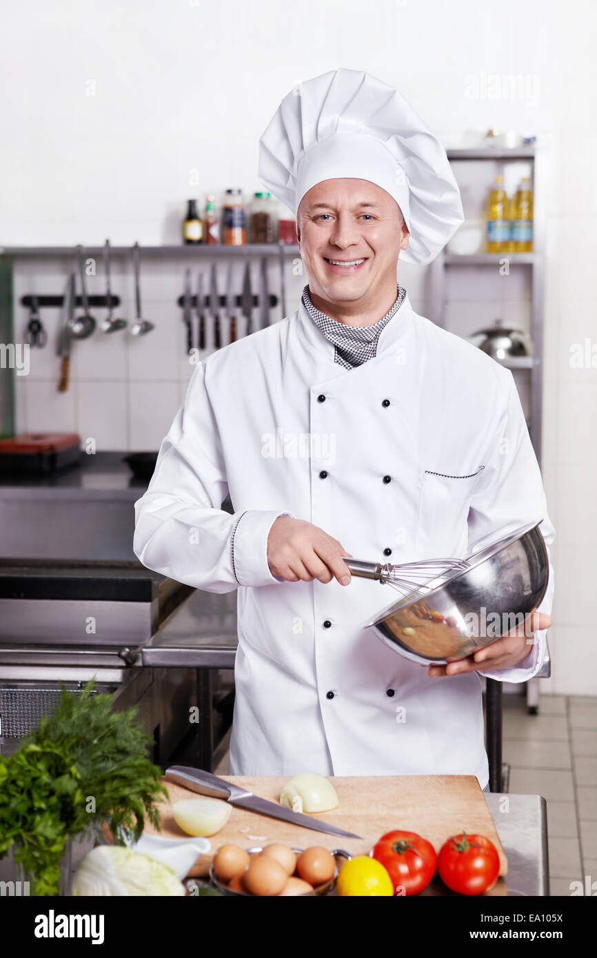 The cook in the kitchen Stock Photo - Alamy
