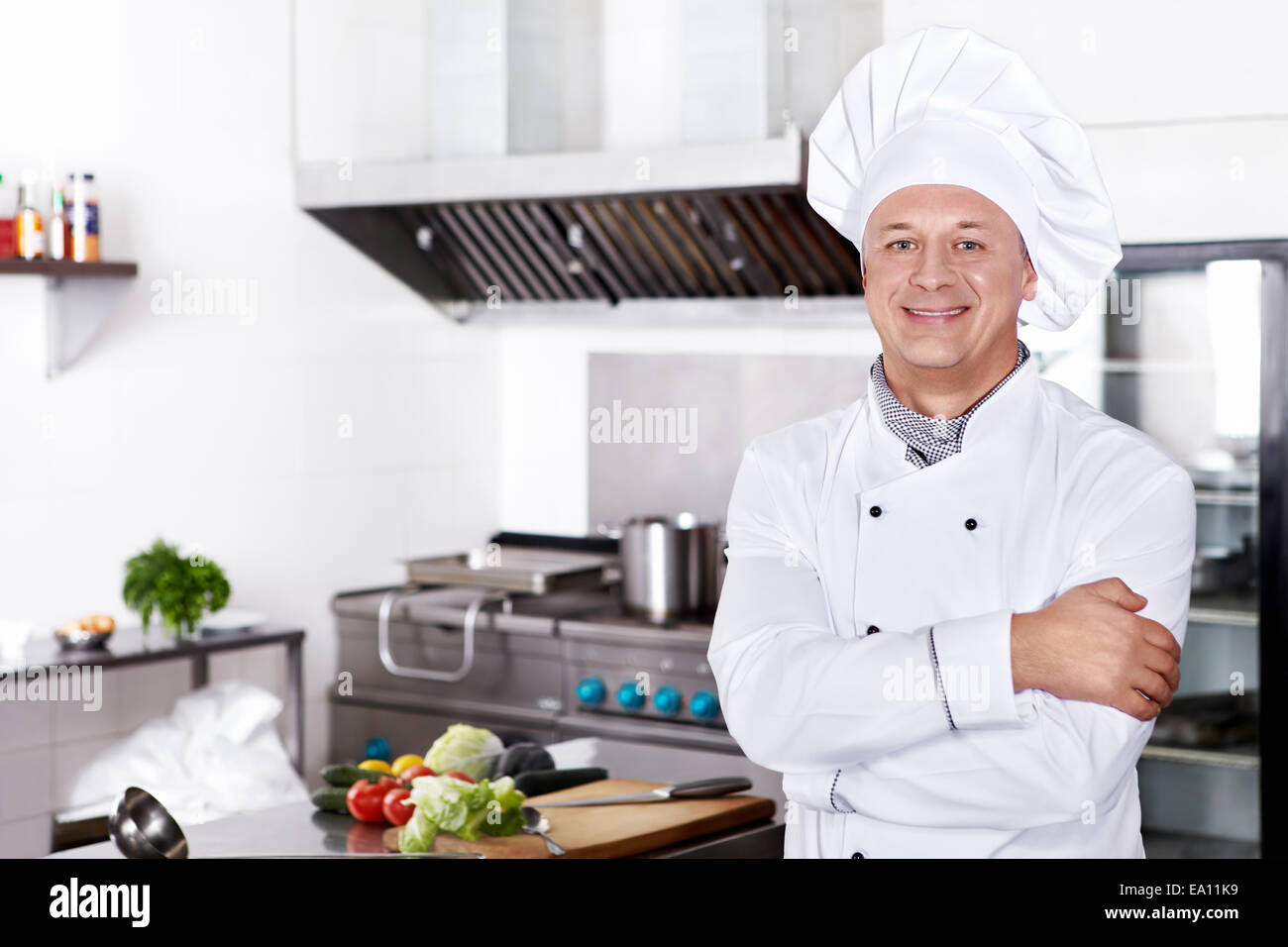Cook in the kitchen Stock Photo - Alamy