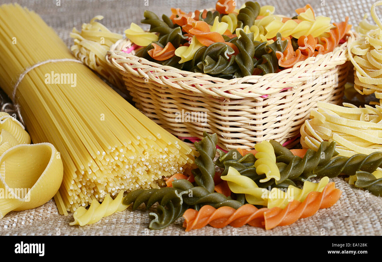 Raw colored pasta fusilli sa a background Stock Photo - Alamy