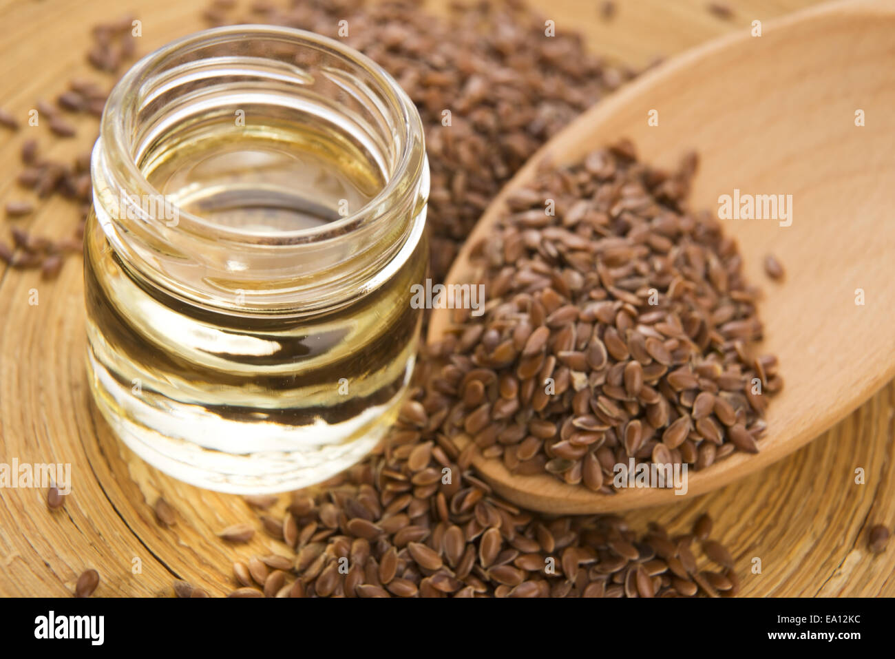 Linseed oil and flax seeds on wooden background Stock Photo - Alamy