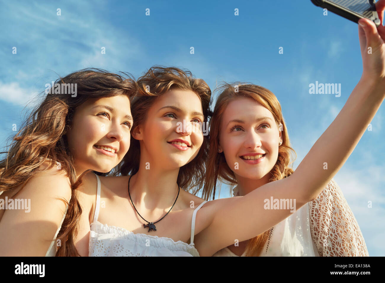 Three young smiling women hi-res stock photography and images - Alamy