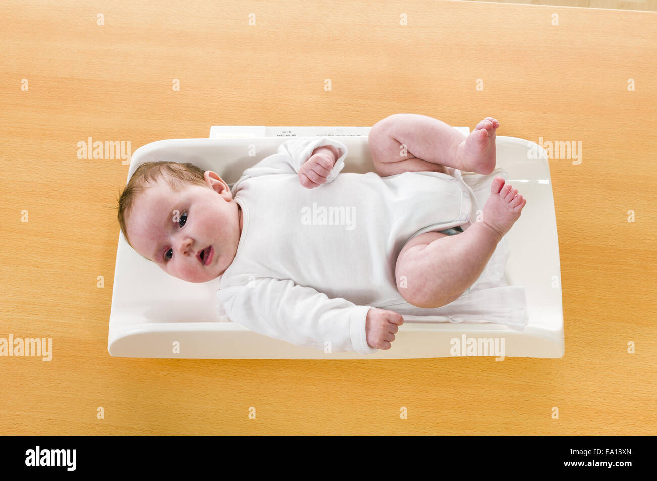 Baby on scale Stock Photo - Alamy