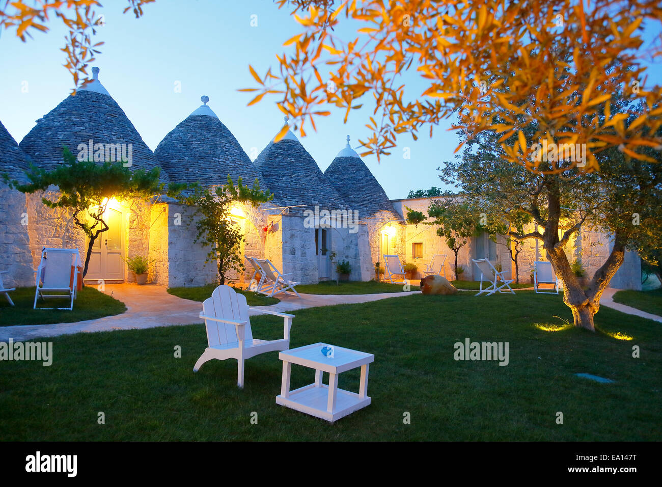 Trulli houses in Masseria Cervarolo at sunset, Ostuni, Brindisi, Puglia ...