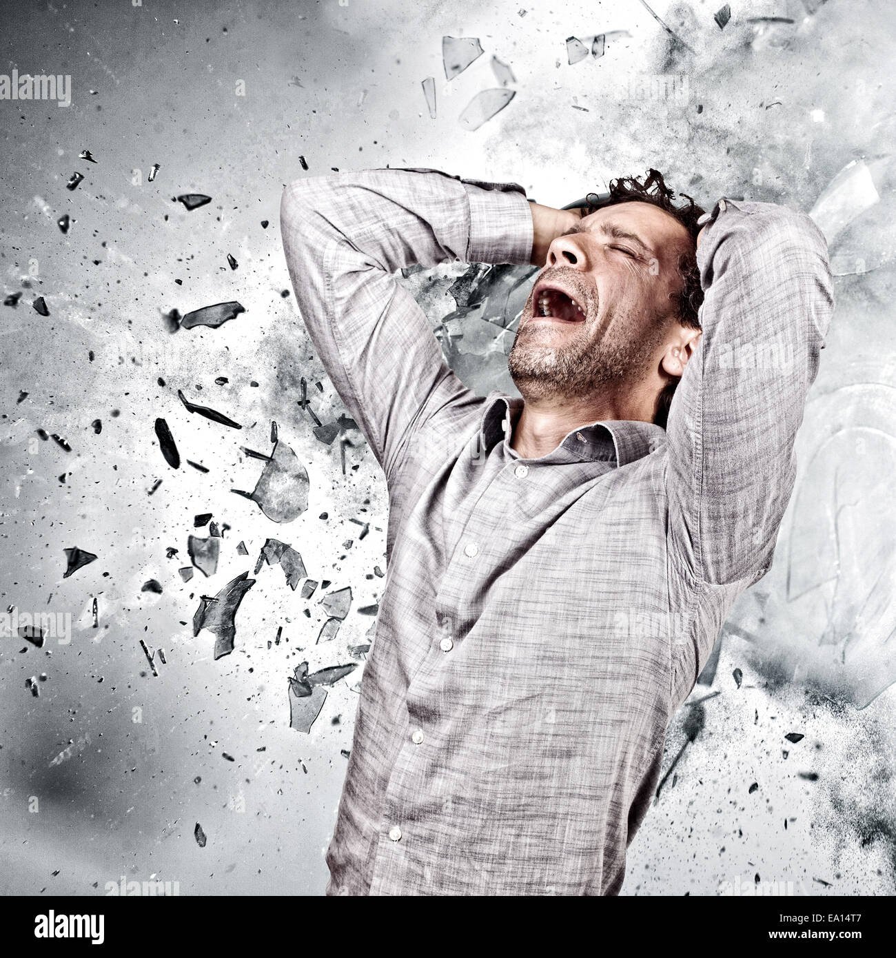 stressed man and background explosion Stock Photo - Alamy